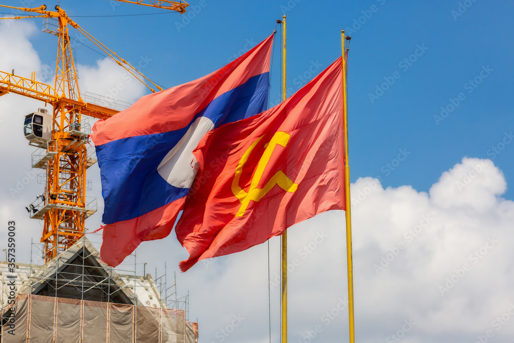 The Lao National Flag with the red flag with communist symbols of a ...