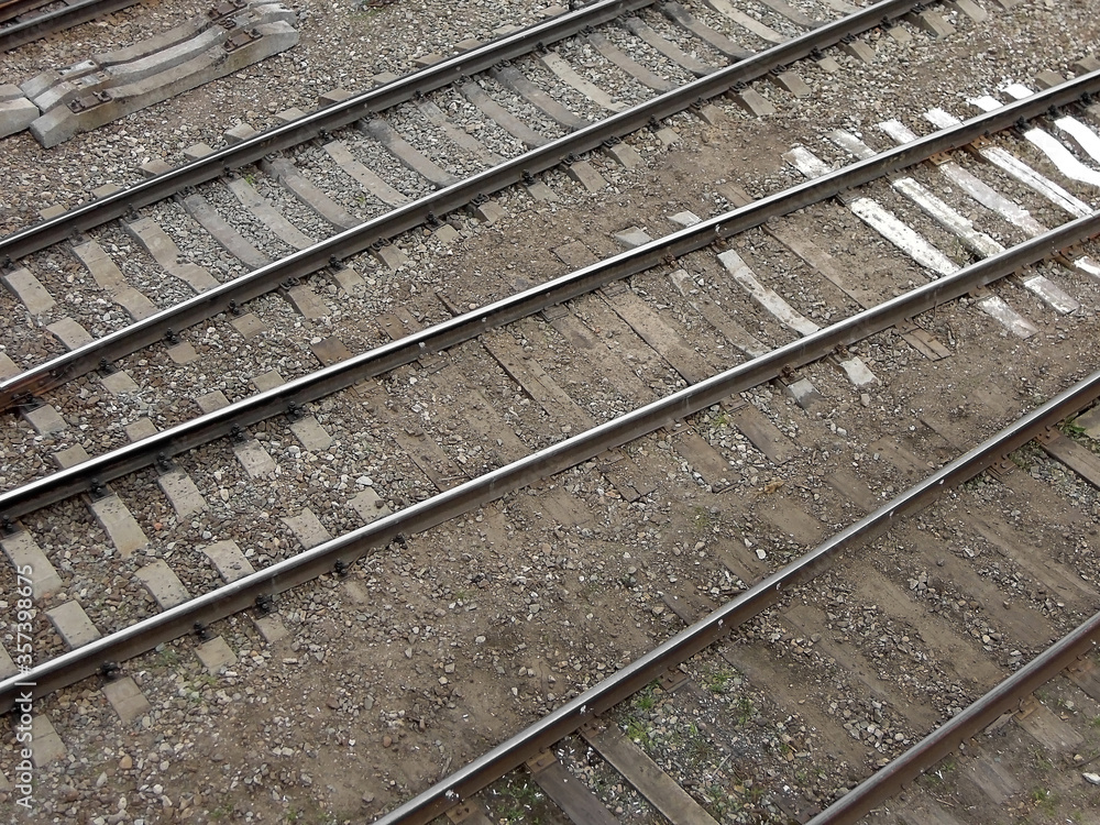 Side view on railroad tracks that directing under several angles ...