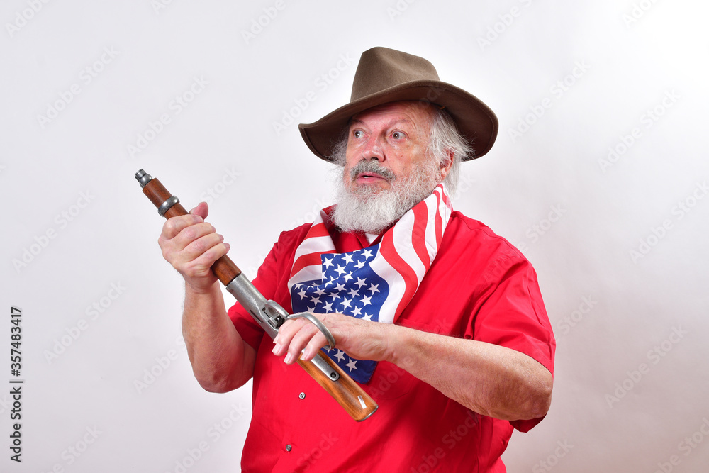 Determined looking old man is cocking his sawed off rifle, sometimes ...