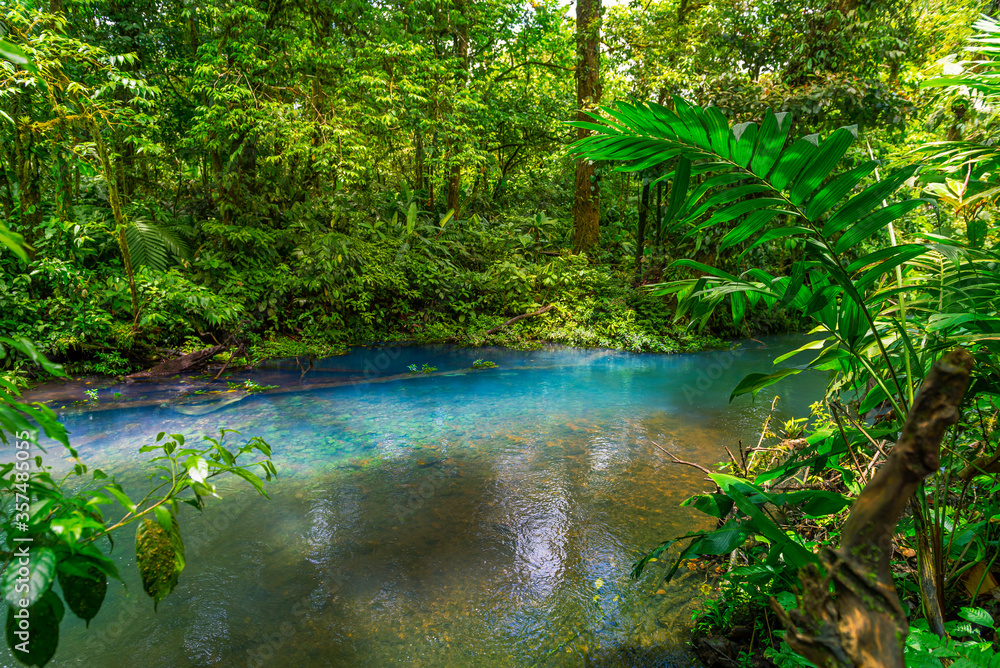 Foto de Rio Celeste with turquoise, blue water. Connection of two ...