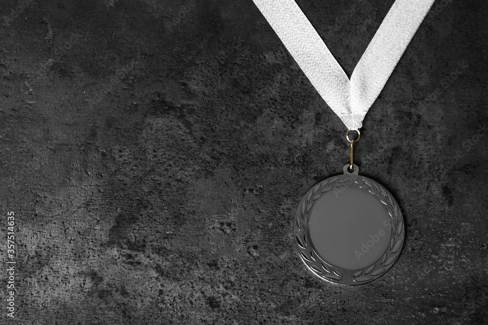 Silver medal on grey stone background, top view. Space for design Stock ...