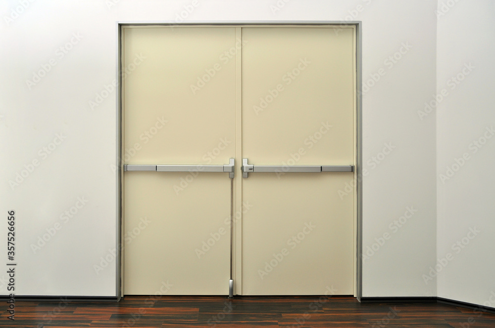 Emergency exit door. Push bar and rail for panic exit Stock Photo ...