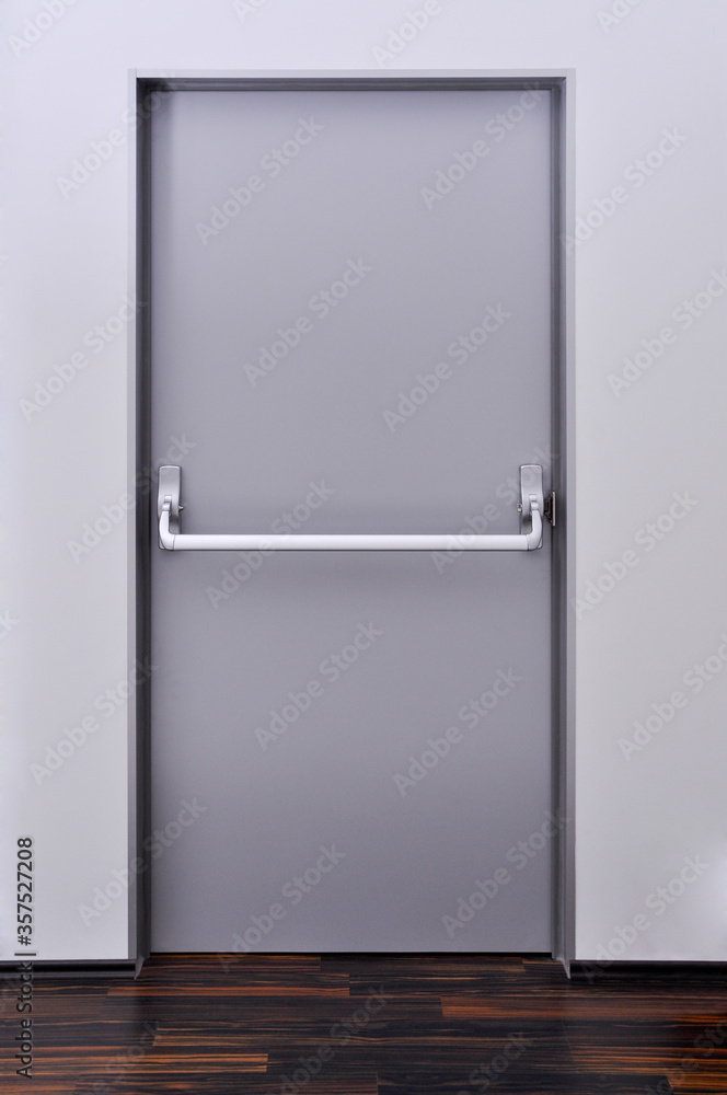 Emergency exit door. Push bar and rail for panic exit Stock Photo ...