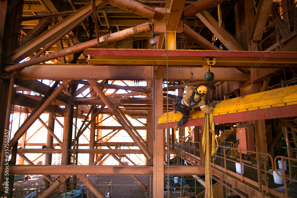 Industrial rope access rigger miner worker wearing safety harness ...