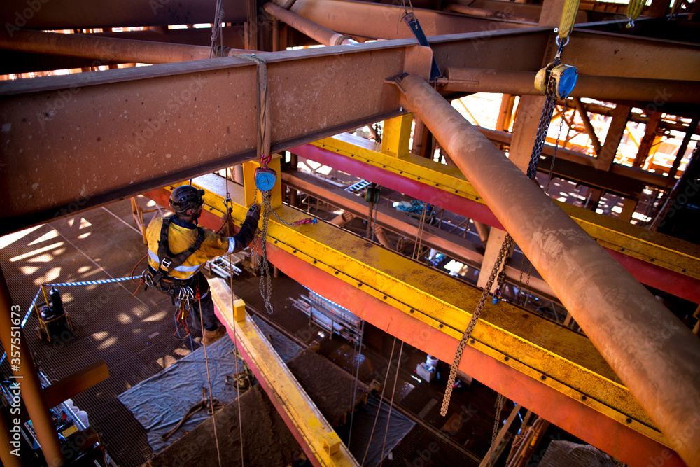 Industrial rope access rigger miner worker wearing safety harness ...