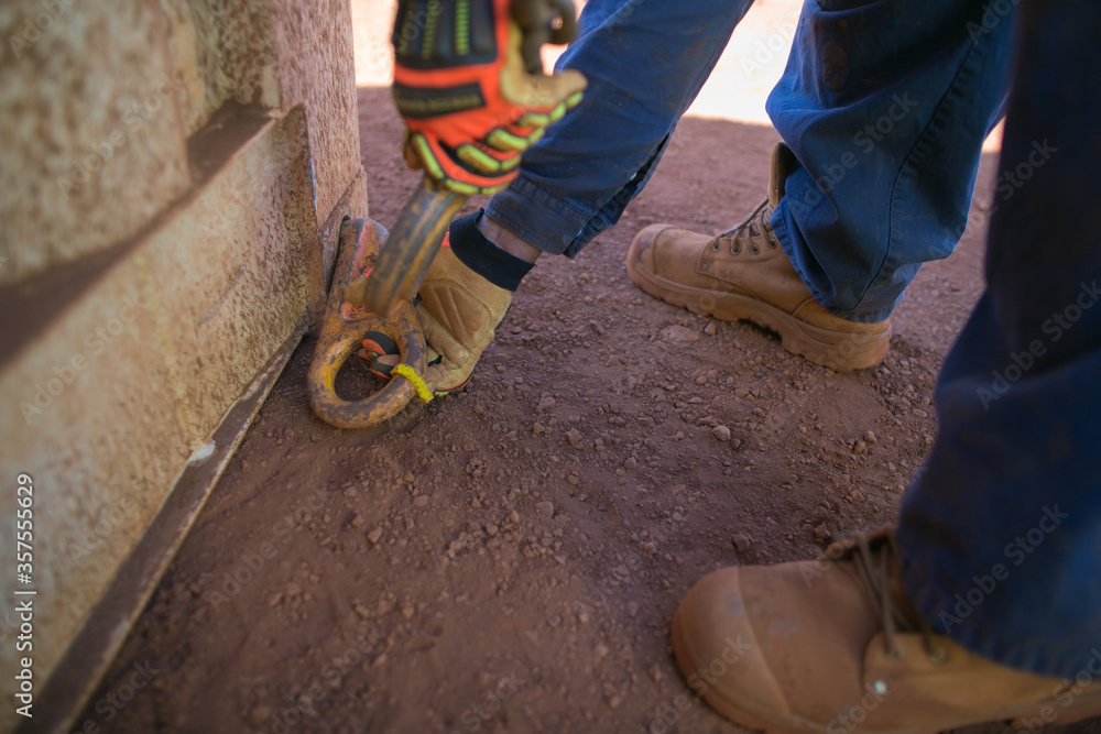 Safe workplace trained competent rigger wearing a safety glove hand ...