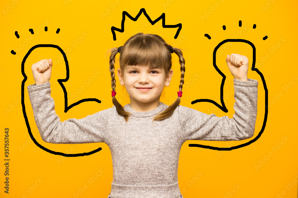 Positive little girl with funny pigtails shows her power biceps with ...