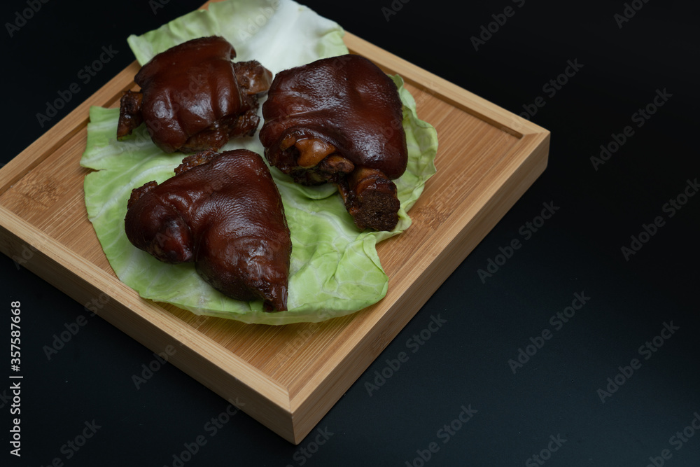 Chinese traditional delicacy marinated pig's feet.Braised pork trotters ...