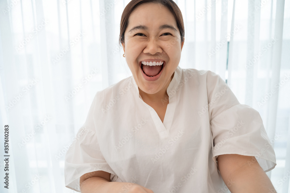 Laughing happy plus size model in casual clothes, fat woman on white ...