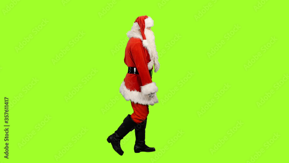 Side view of walking Santa against green screen background, Chroma key ...