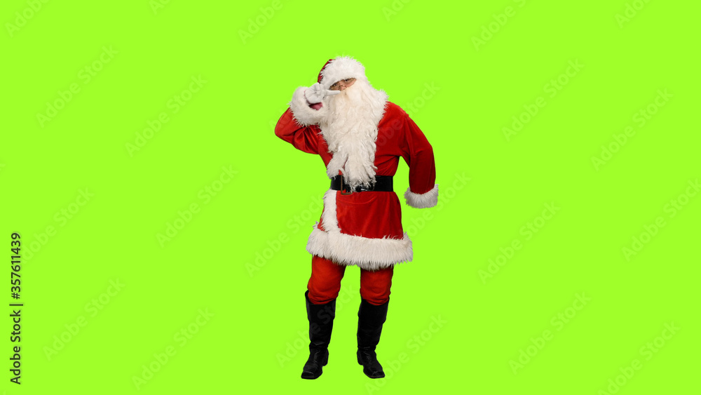 Santa Claus performing dance against green screen background, chroma ...