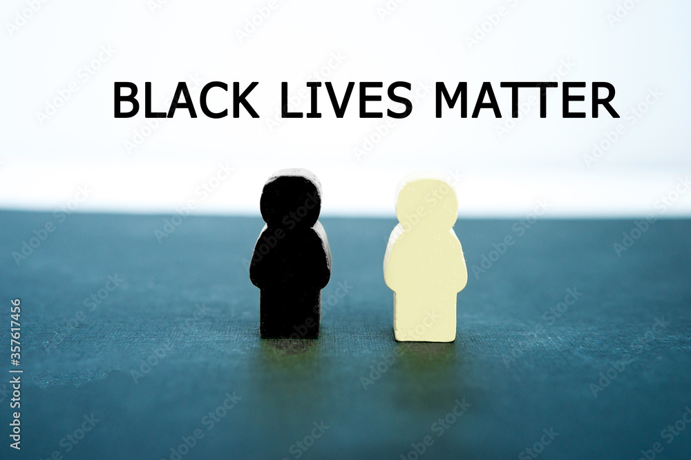 Black and white figures of people on a black background. The ...