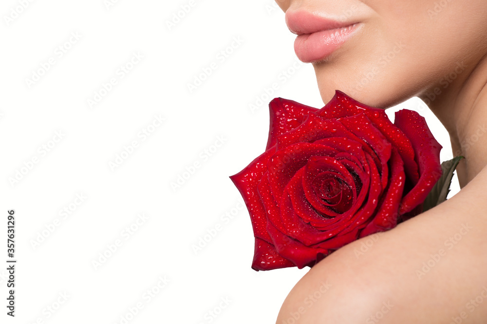 ips, shoulder, part of the face of a woman. Red rose in her hands. Skin ...