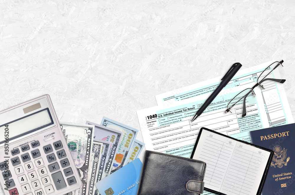 IRS form 1040 Individual income tax return lies on flat lay office ...