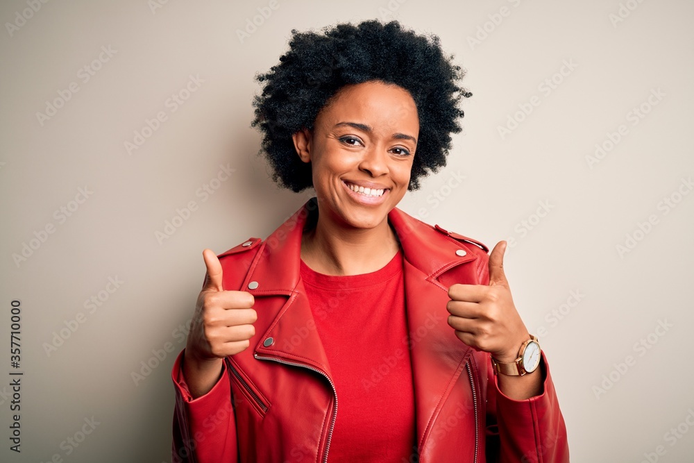 Young beautiful African American afro woman with curly hair wearing ...