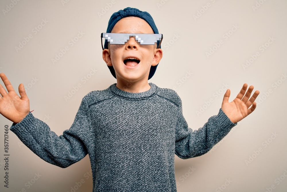 Young little caucasian kid wearing internet meme thug life glasses over ...