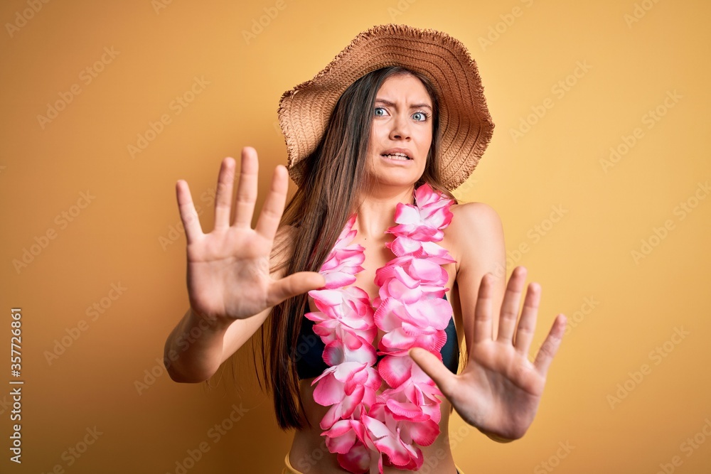 Young beautiful woman with blue eyes on vacation wearing bikini and ...