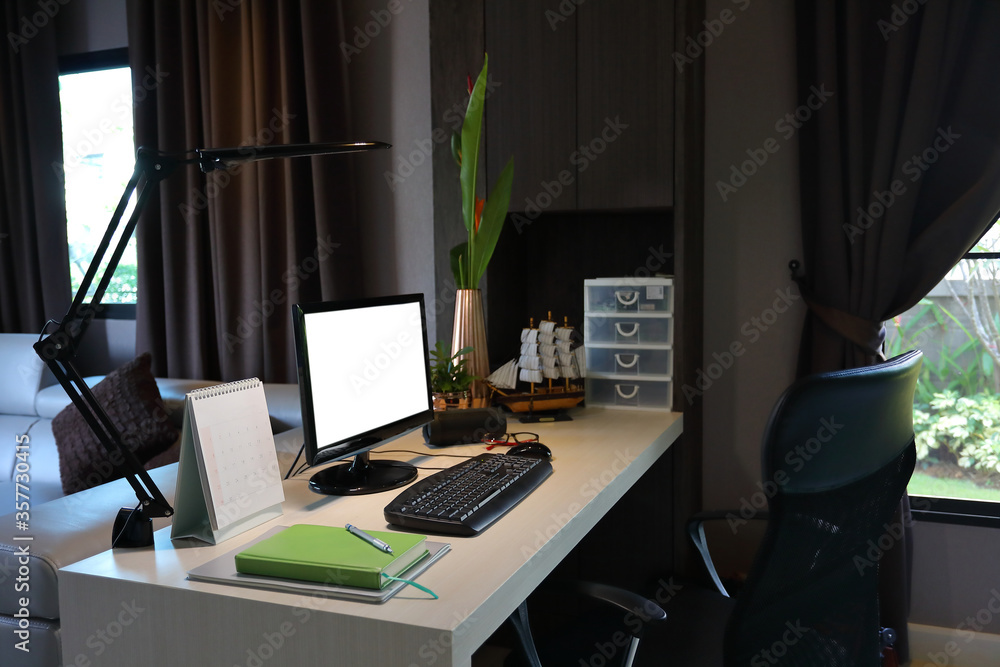 table work with white blank desktop pc computer on desk inside room of ...