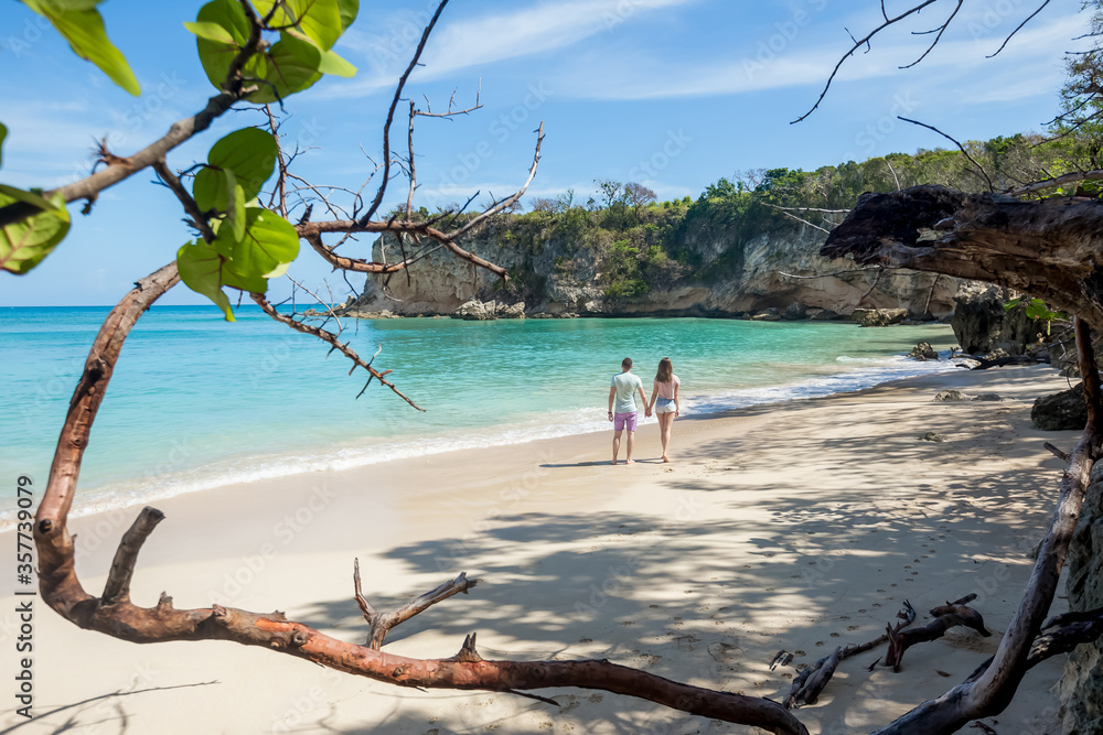 Romantic couple in love enjoying beach, hugging, kissing and running on ...