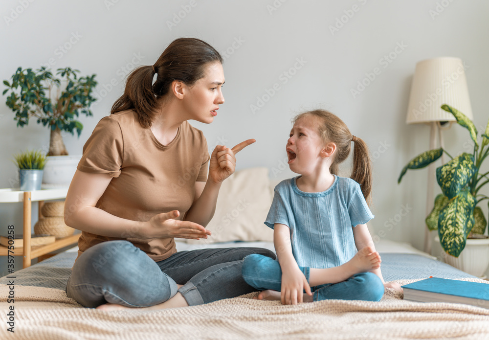 mother is scolding her child girl. Stock Photo | Adobe Stock