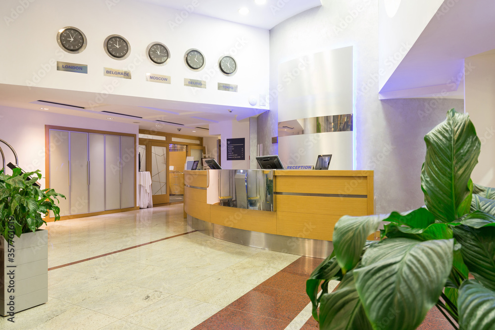 Interior of a hotel reception area with wooden reception desk Stock ...