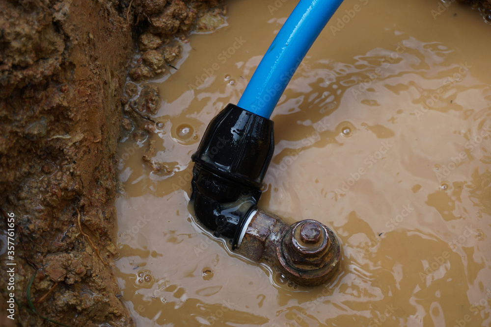 HDPE pipe leaking on ferrule connection is being repaired Stock Photo ...