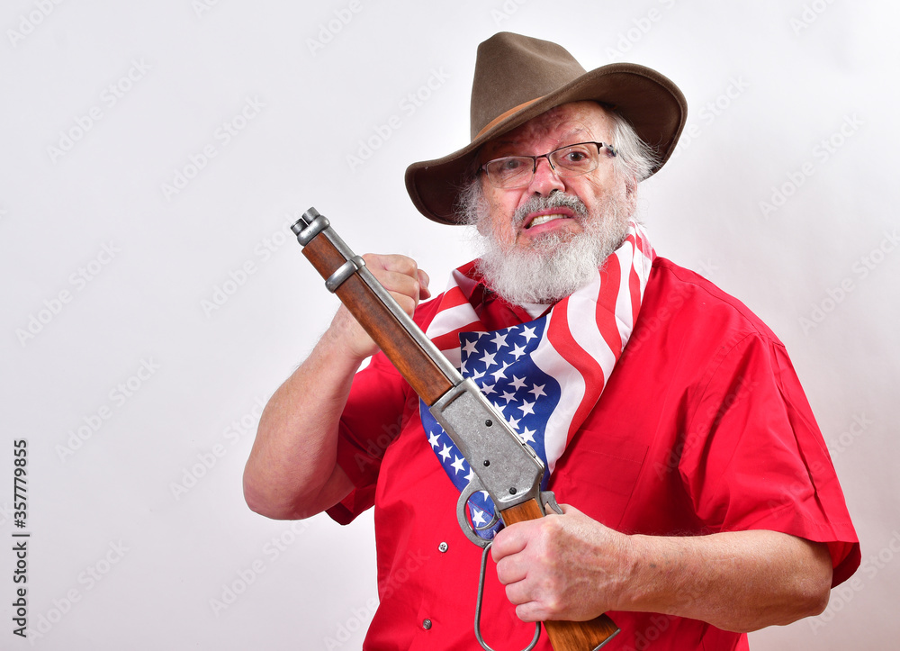 Angry old man, armed with a sawed off rifle, wearing patriotic colors ...