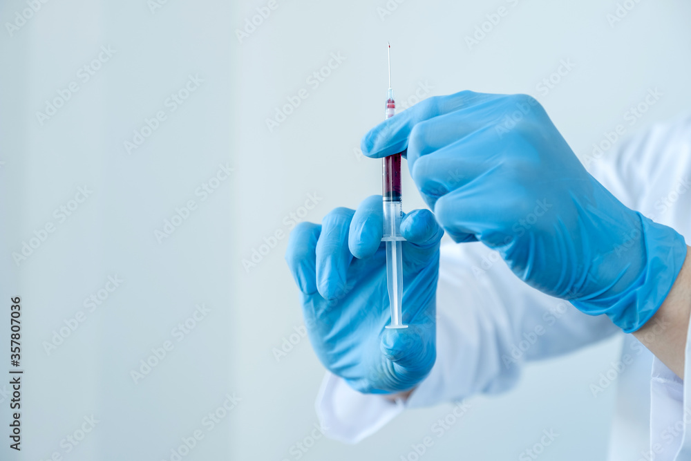 Professional doctors perform find virus tests from samples of blood ...