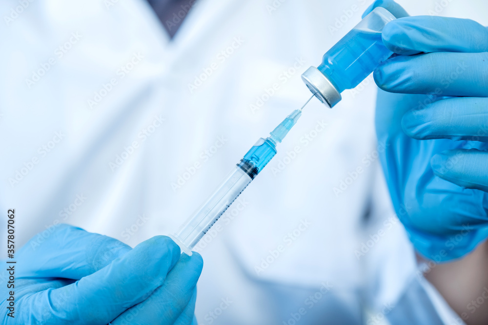 Professional doctors perform testing and analyzing samples of vaccines ...