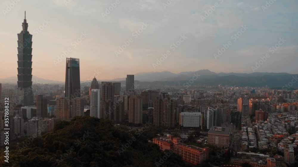 Taipei skyline modern buildings at sunset. Stunning orange colors in ...