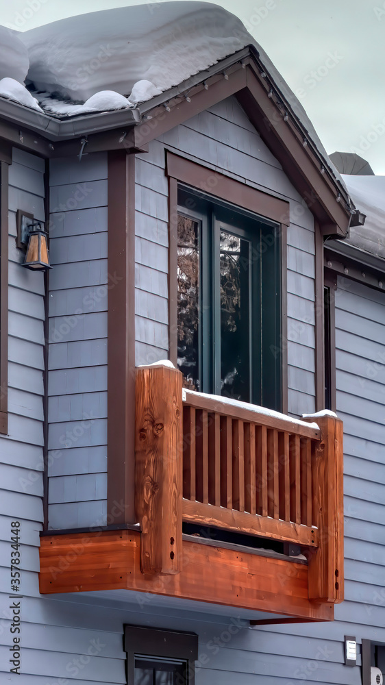 Vertical frame Box bay window of home with gable roof sliding door and ...