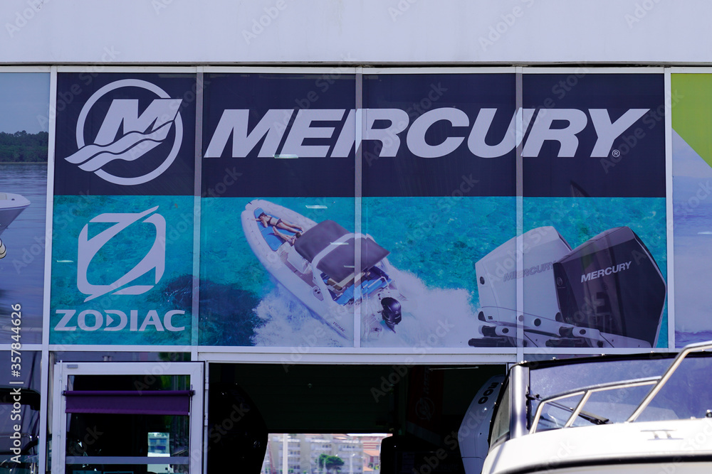 Mercury and zodiac sign logo on building Marine sell boats and engines ...