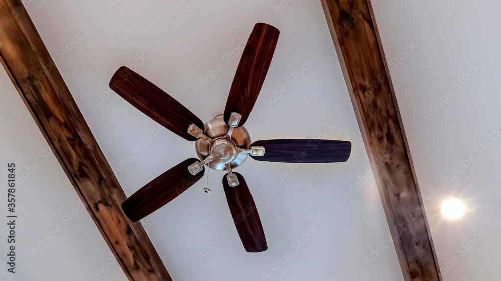 Panorama frame Living room ceiling fan flanked by decorative wood beams ...