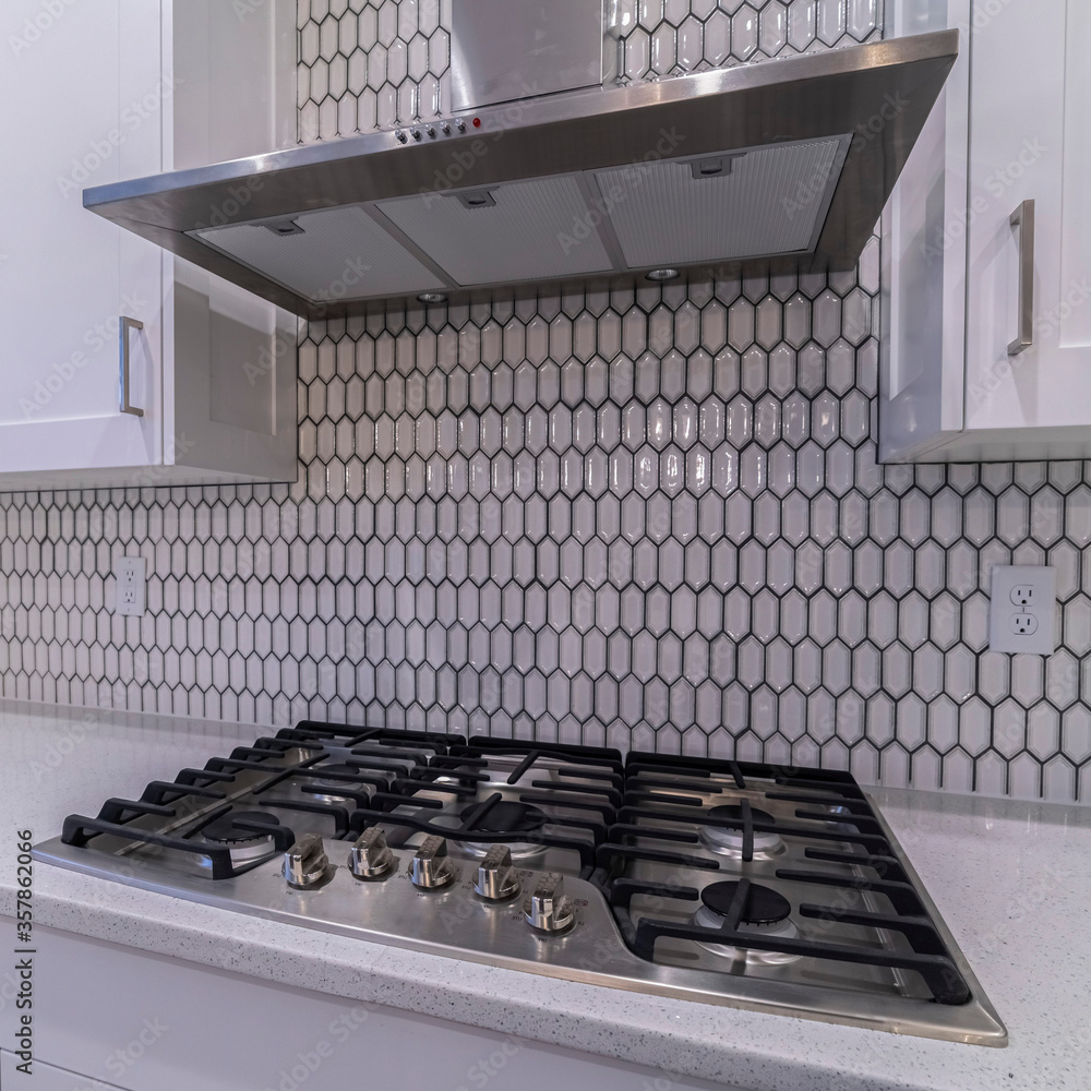 Square crop Modern cooker hob and extractor fan interior Stock Photo ...