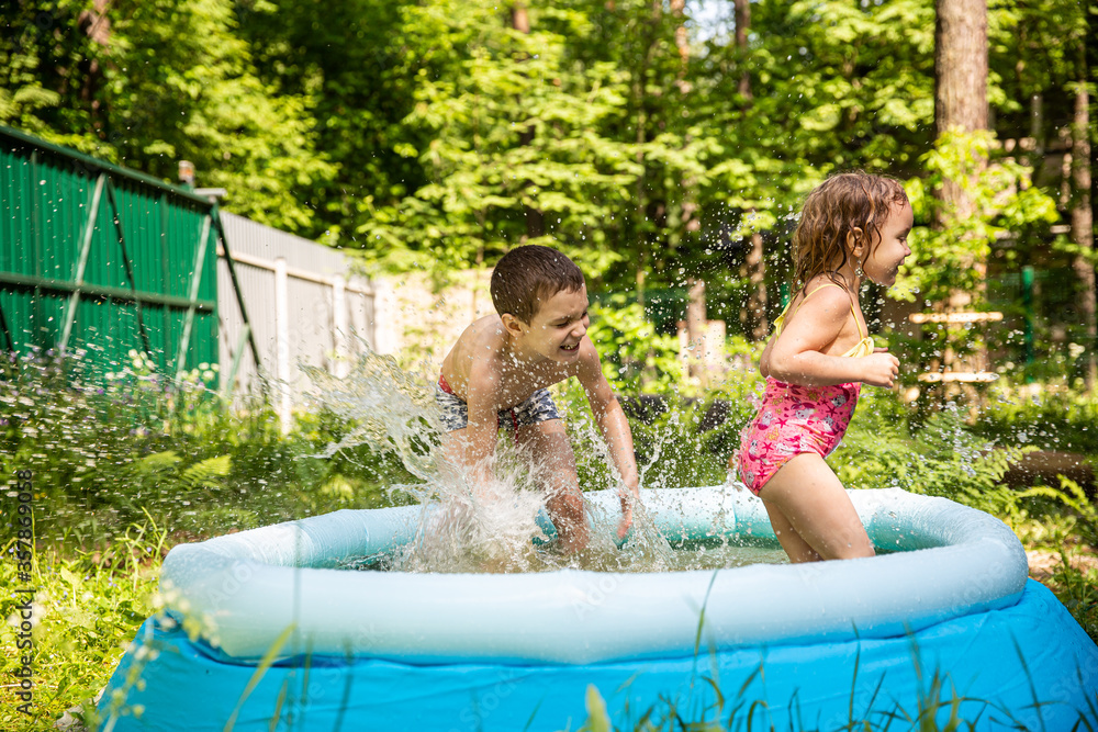 children at the cottage splash in the pool, children's vacations, hot ...