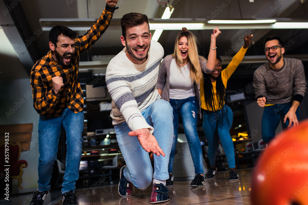 Group of friends enjoying time together laughing and cheering while ...