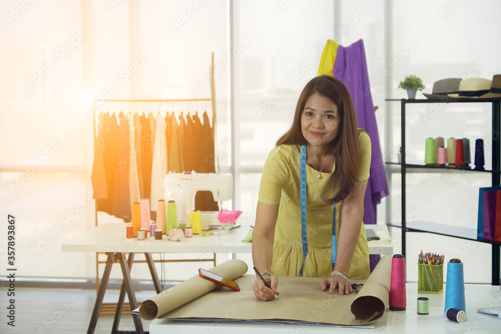 Asian senior woman designer is drawing designing Sketch of new pattern ...