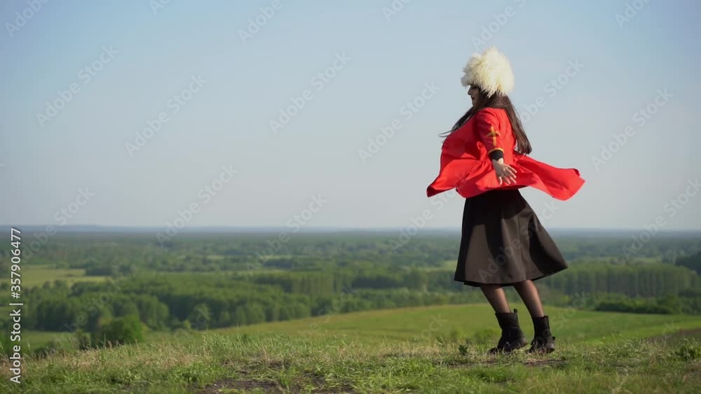 Georgian girl in white papakha and red national dress dances national ...