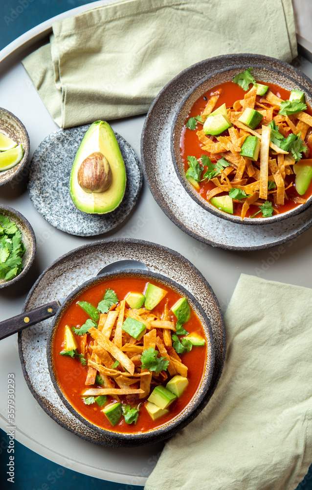 Mexican style table with spicy aztec soup with fried tortilla. Sopa ...