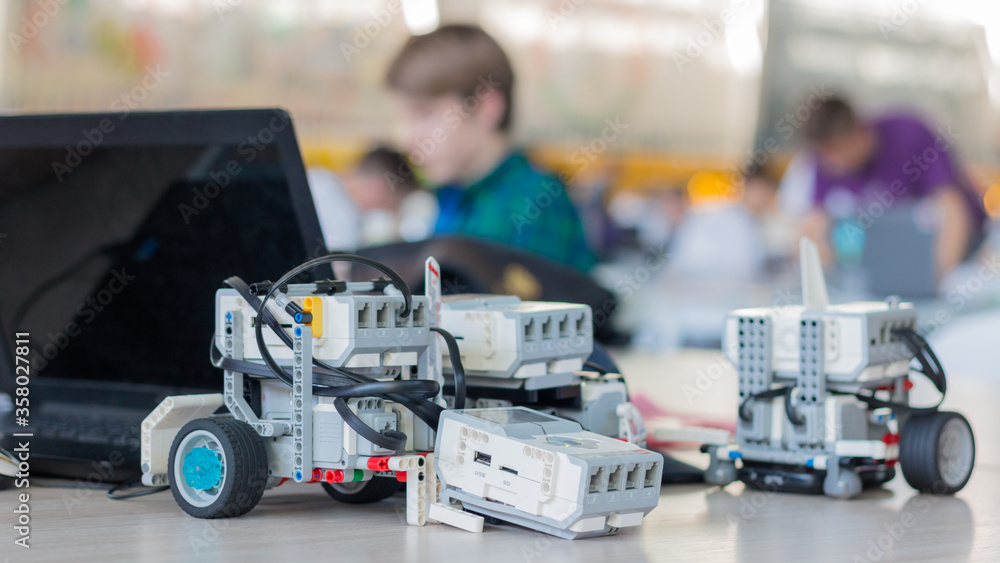 Minsk, Belarus. March, 2018. Boys construct and code robots. Lego ...