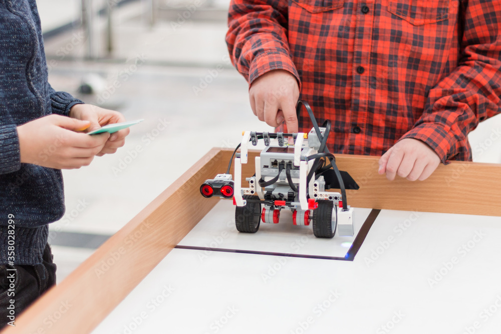 Minsk, Belarus. March, 2018. Boys construct and code robots. Lego ...