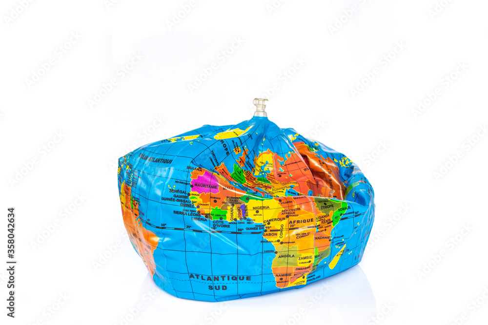 Planet earth toy balloon deflated isolated on white background. Earth ...