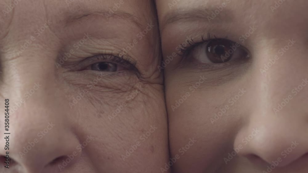 Mother and daughter, face close-up, generations, look alikes, happy ...