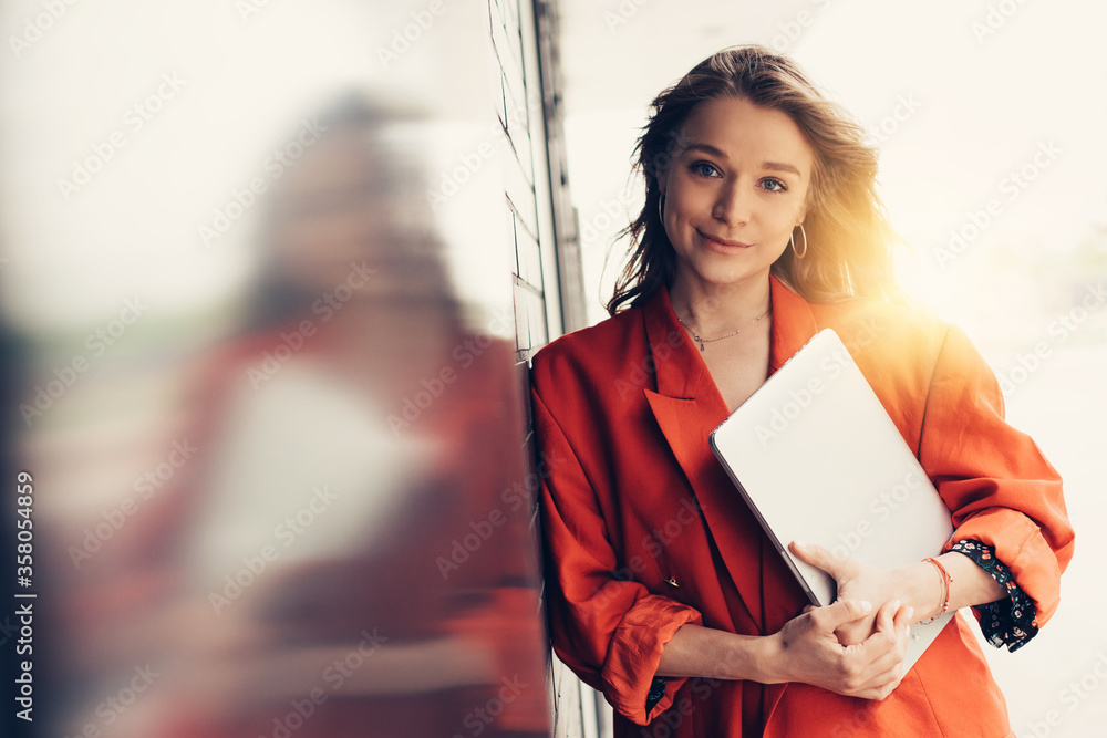 Picture of beautiful confident young businesswoman lean to wall and ...