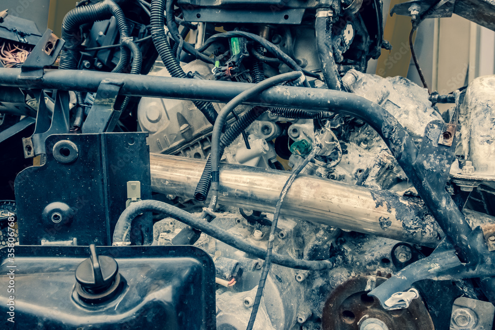 Vehicle, tricycle, after an accident. A burned motorcycle near the ...