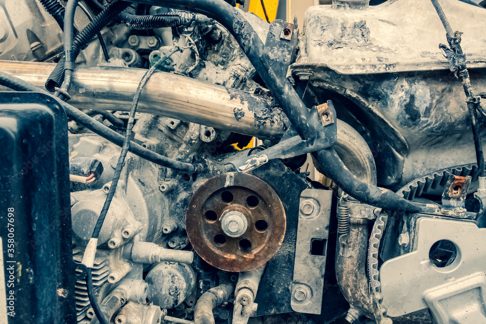Vehicle, tricycle, after an accident. A burned motorcycle near the ...
