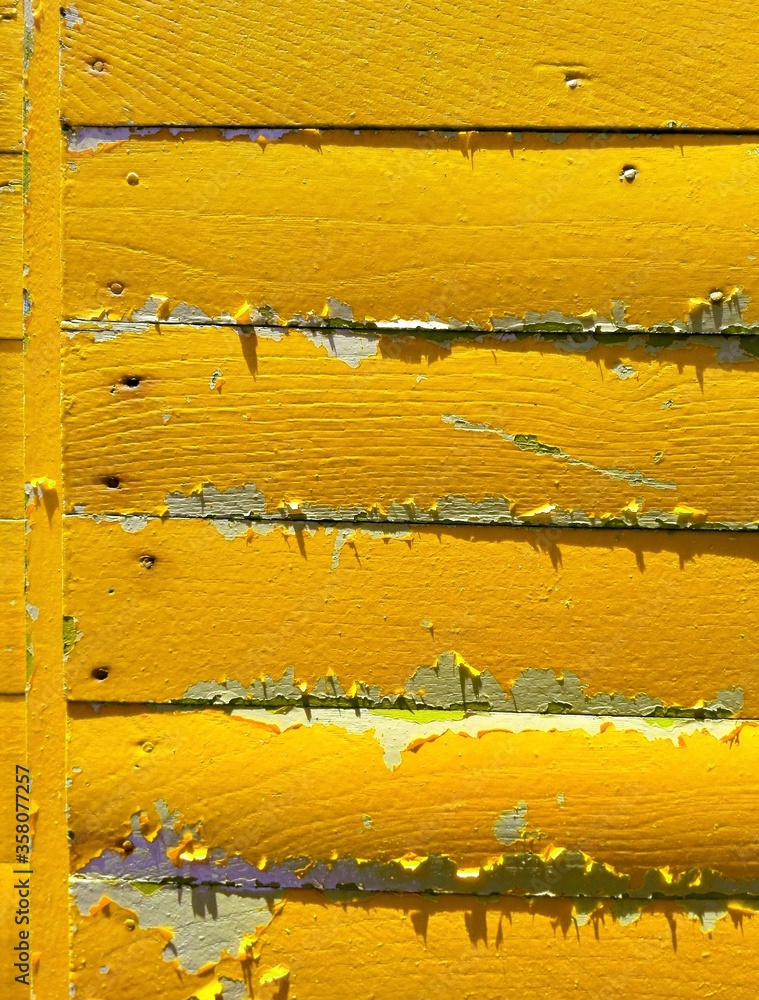 Yellow list wood wall cracked background. Close-up wall wooden yellow ...