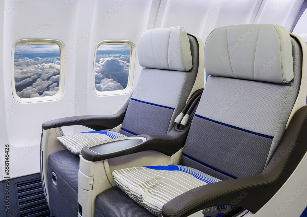 Seat rows in an airplane cabin Stock Photo | Adobe Stock