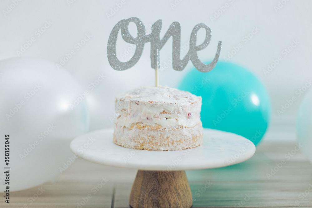 birthday cake with one sign for first birthday and balloons Stock Photo ...