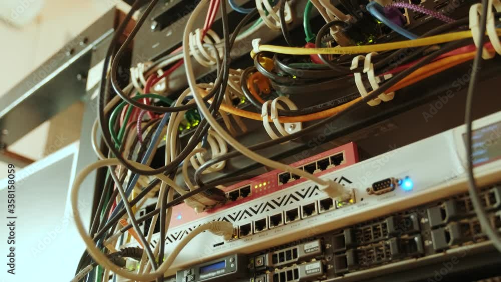 Video Stock Network switch and ethernet cable in rack cabinet. Network ...